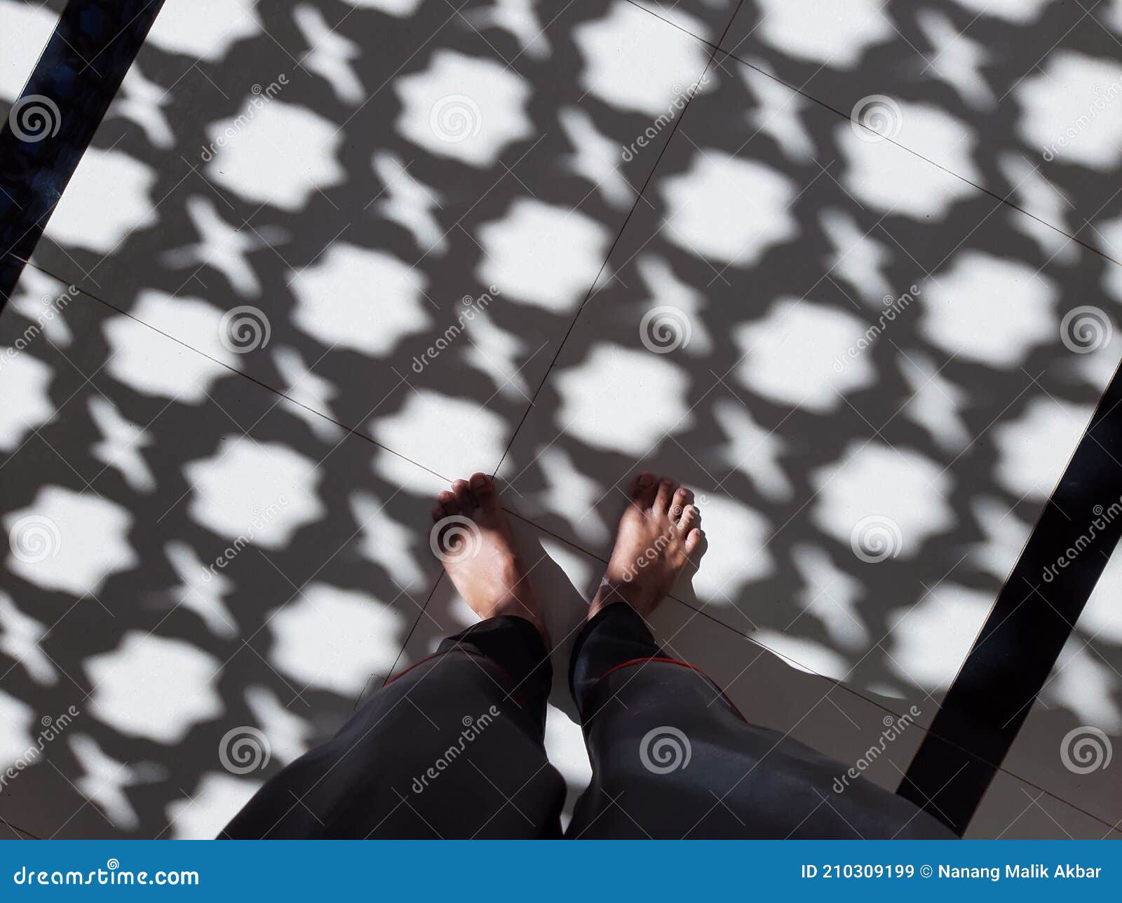 A Man Standing on the Floor with Abstract Shadow from the Arabic Style ...