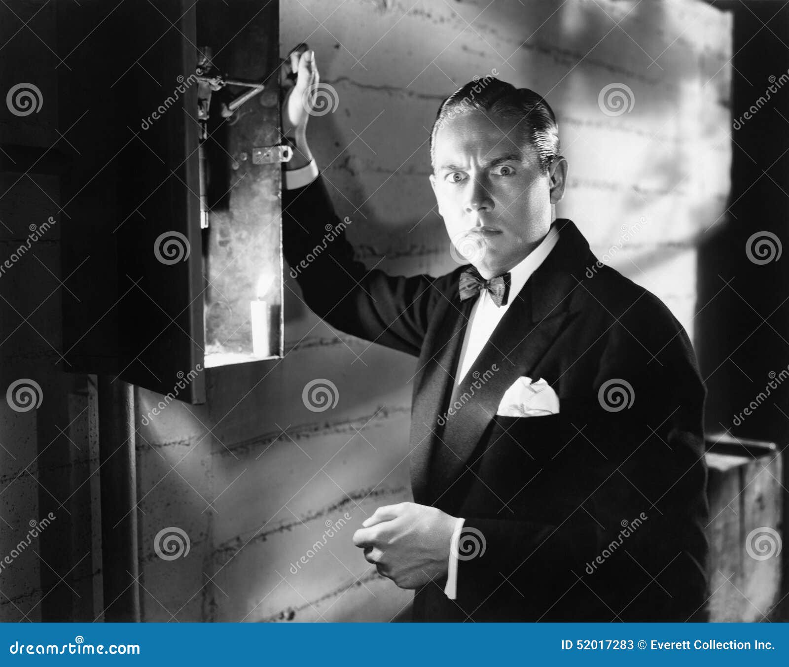 Man Standing in Front of a Fuse Box Looking Frightened Stock Image ...
