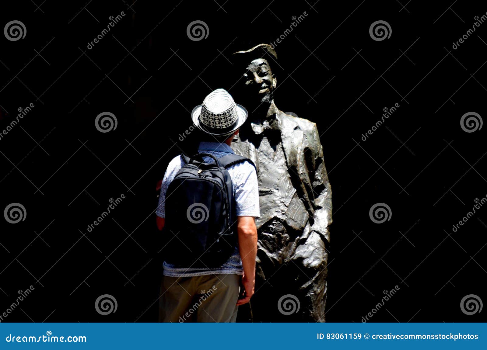 Man Standing In Front Of Statue Photo Picture. Image: 83061159