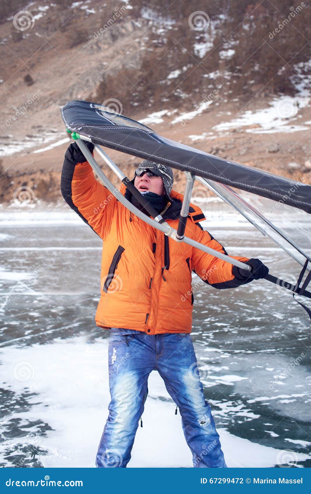 Man Standing on Ice with Wing in the Hands. Stock Photo - Image of ...