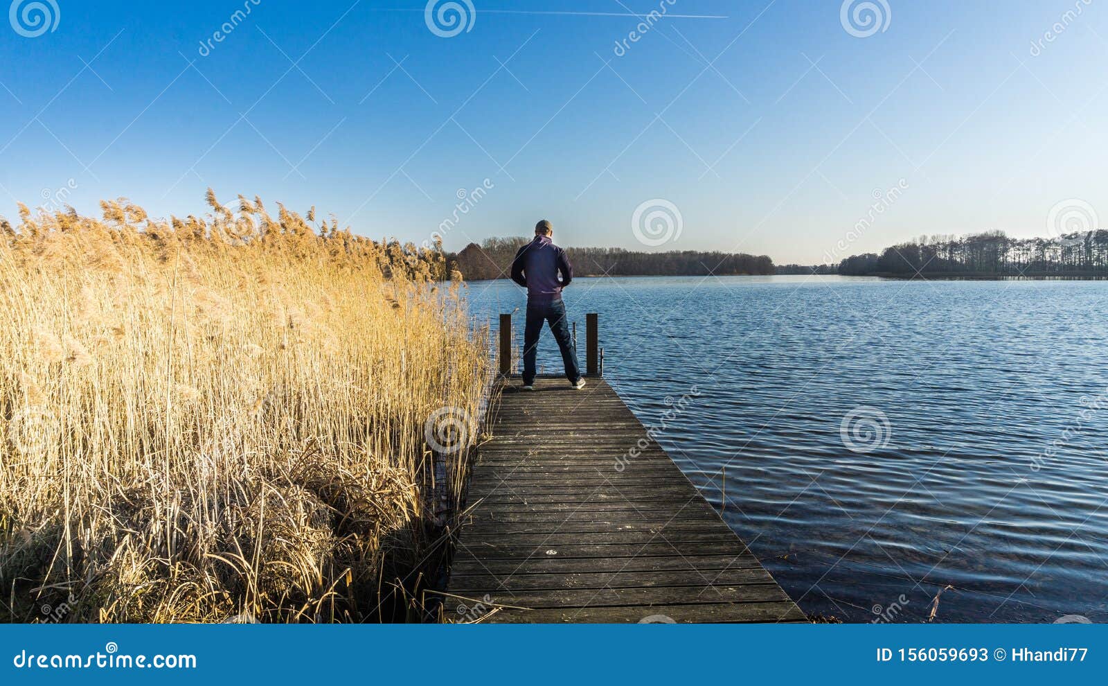 Man Standing on Jetty at a Lake Stock Image - Image of coast ...