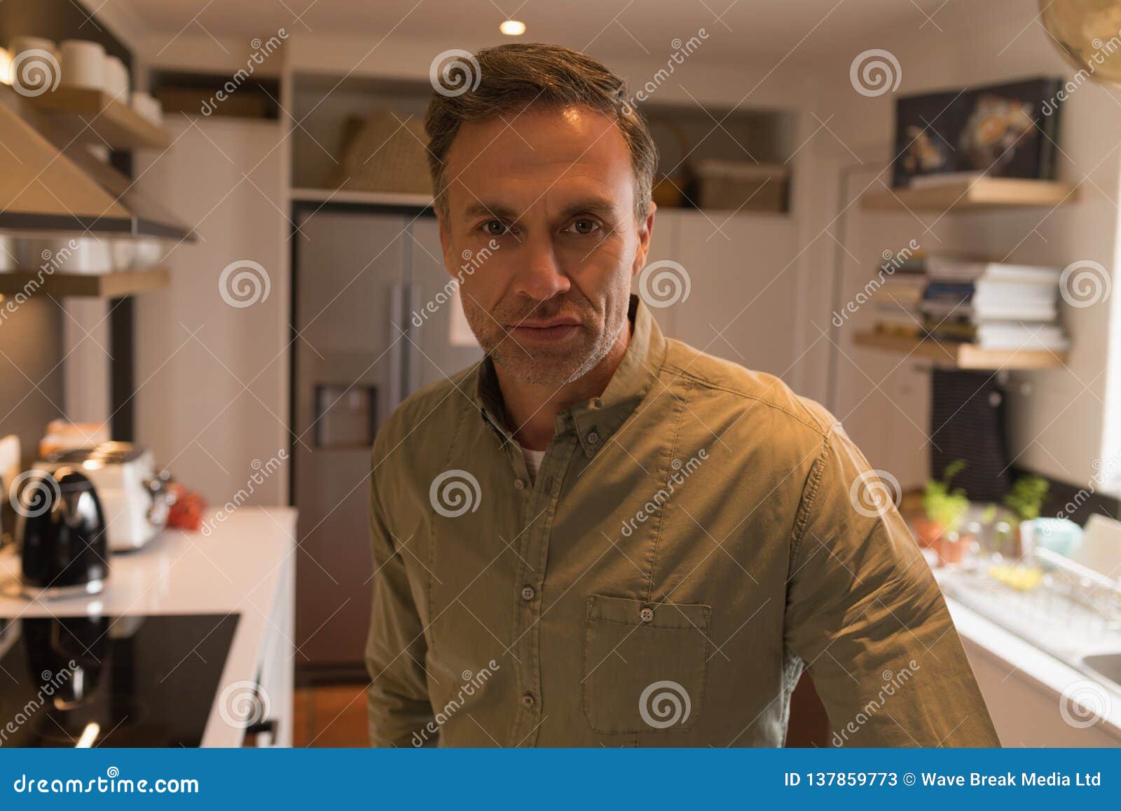 Man Standing in Kitchen at Home Stock Image - Image of fridge, cooking ...