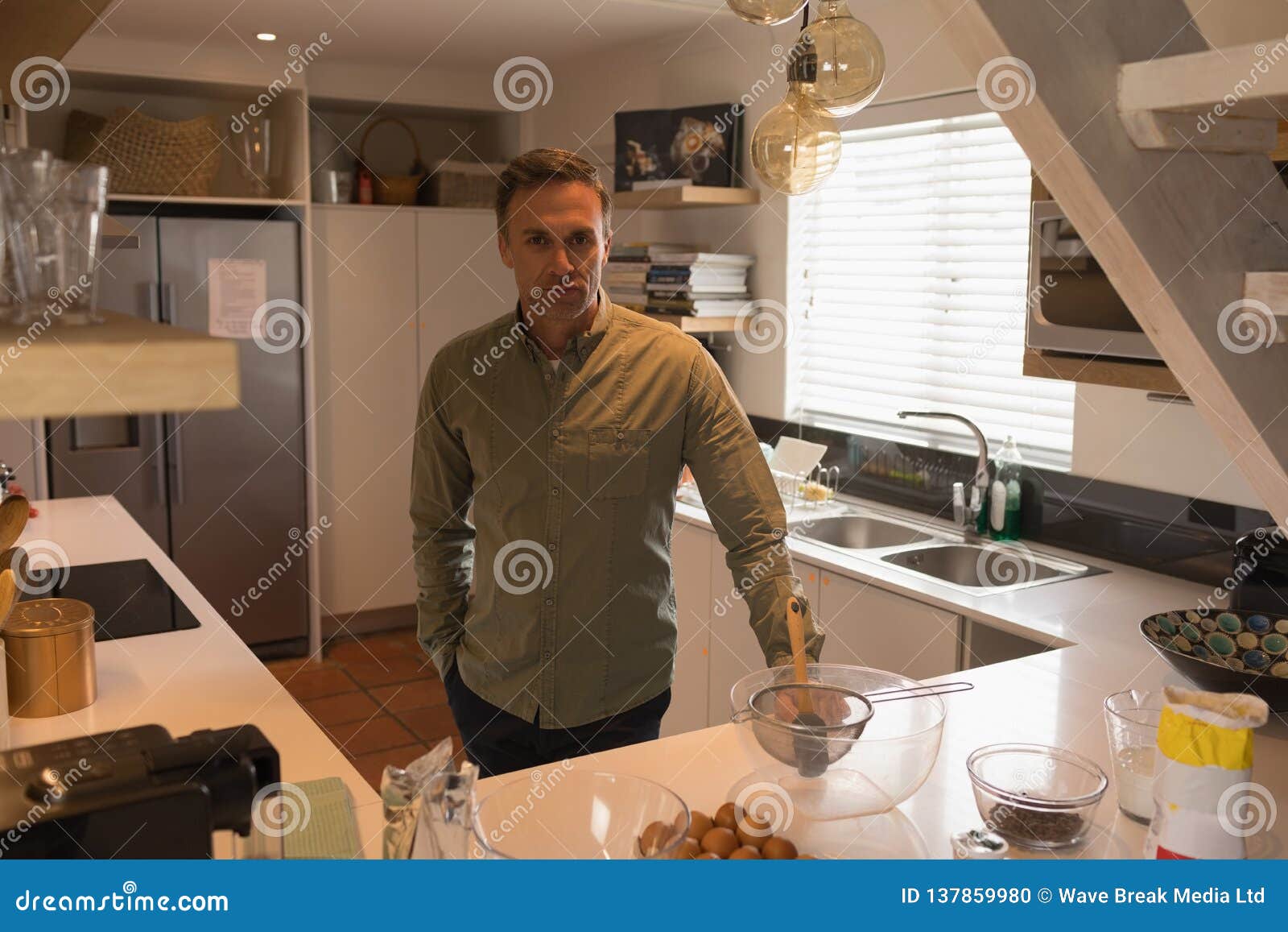 Man Standing in Kitchen at Home Stock Photo - Image of homey, baking ...