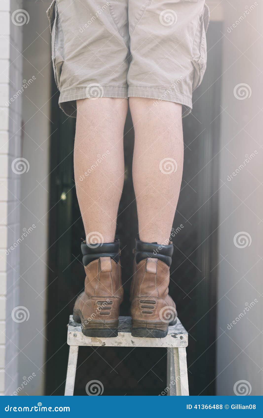 A Man Standing on a Ladder, Workboots Stock Photo - Image of tradesman ...