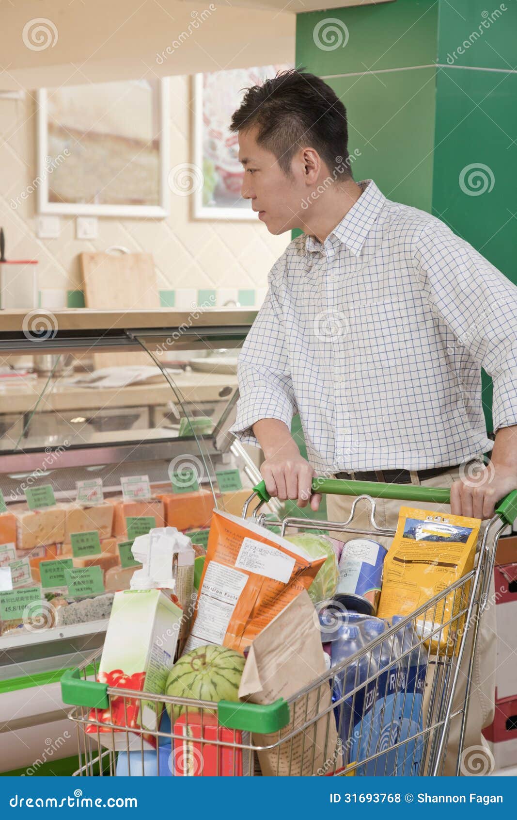 Man Standing and Looking at the Deli Counter, Beijing Stock Photo ...