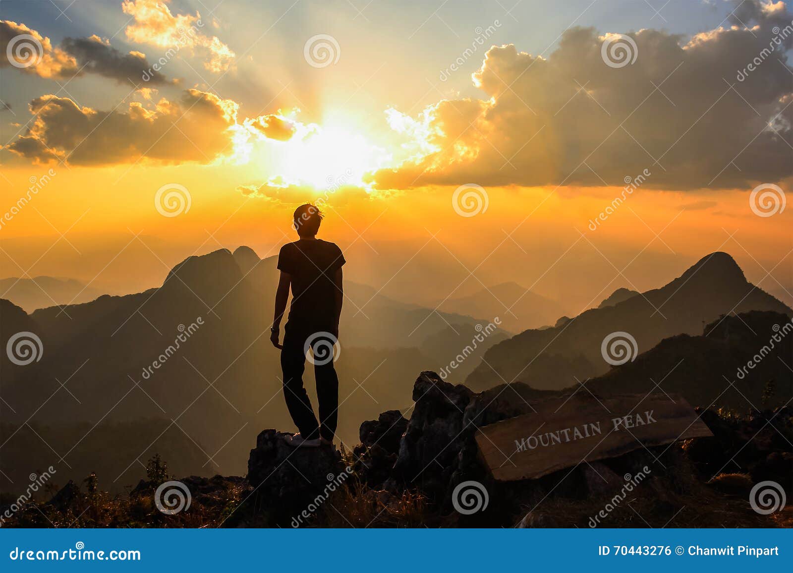 Man Standing on Mountain Peak at Sunset Stock Photo - Image of cloudy ...