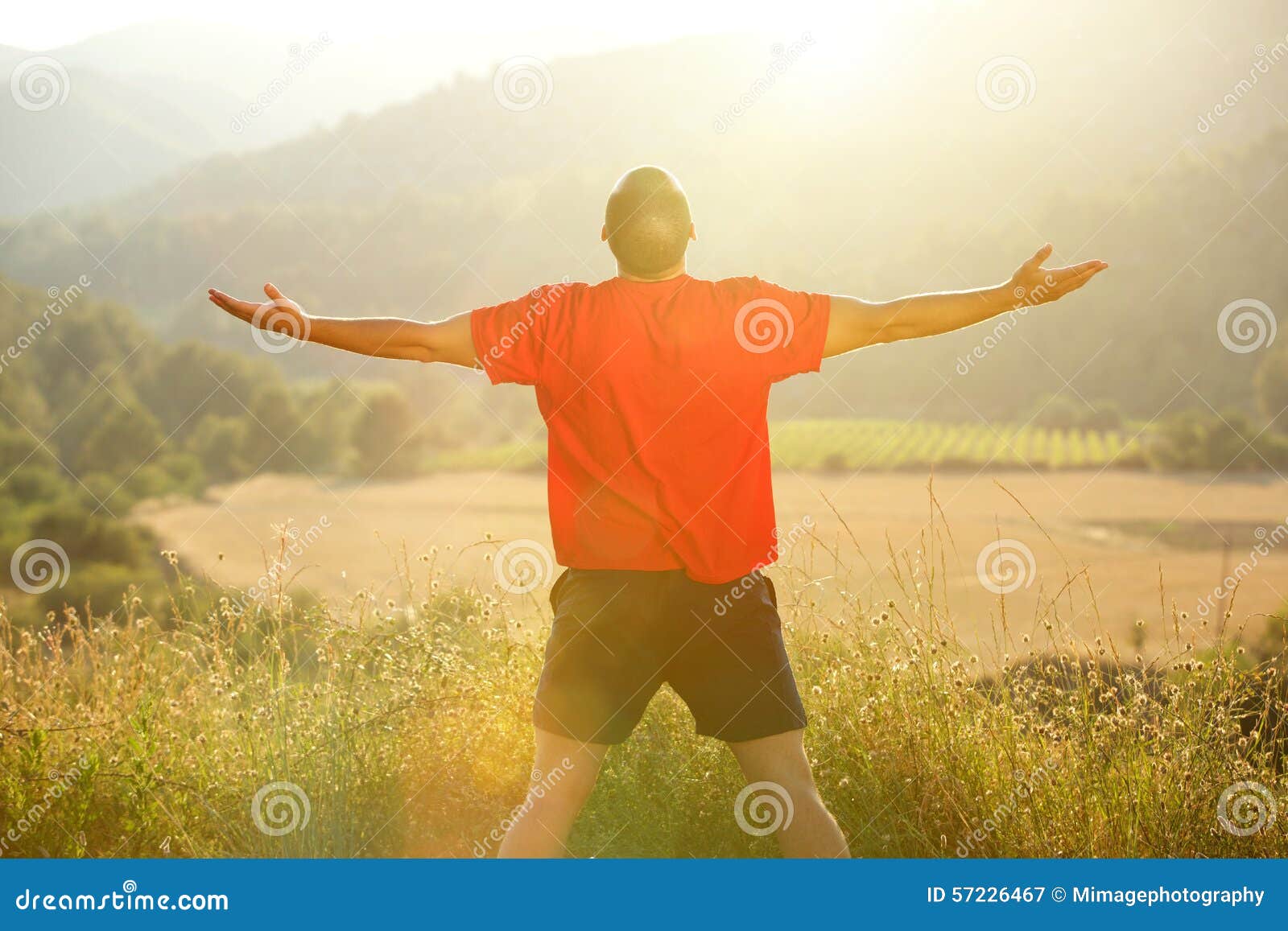 Man Standing in Nature with Arms Outstretched Stock Image - Image of ...