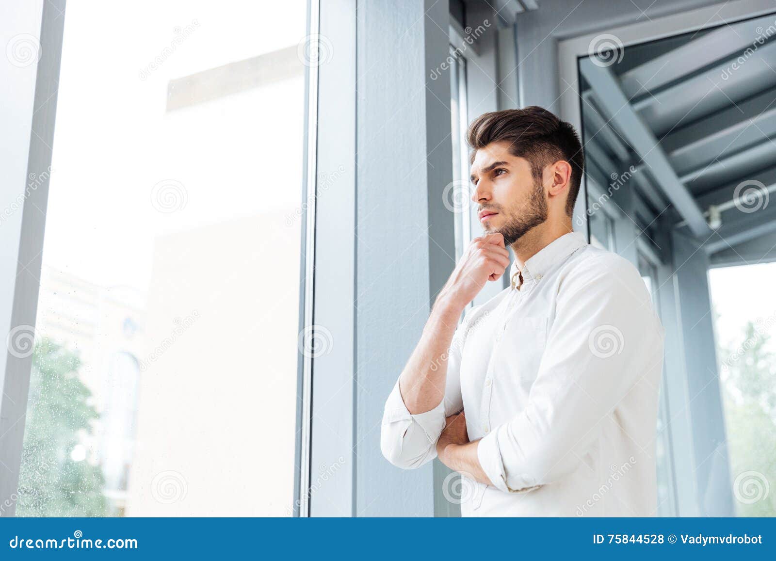 Man Standing Near the Window and Thinking Stock Photo - Image of ...