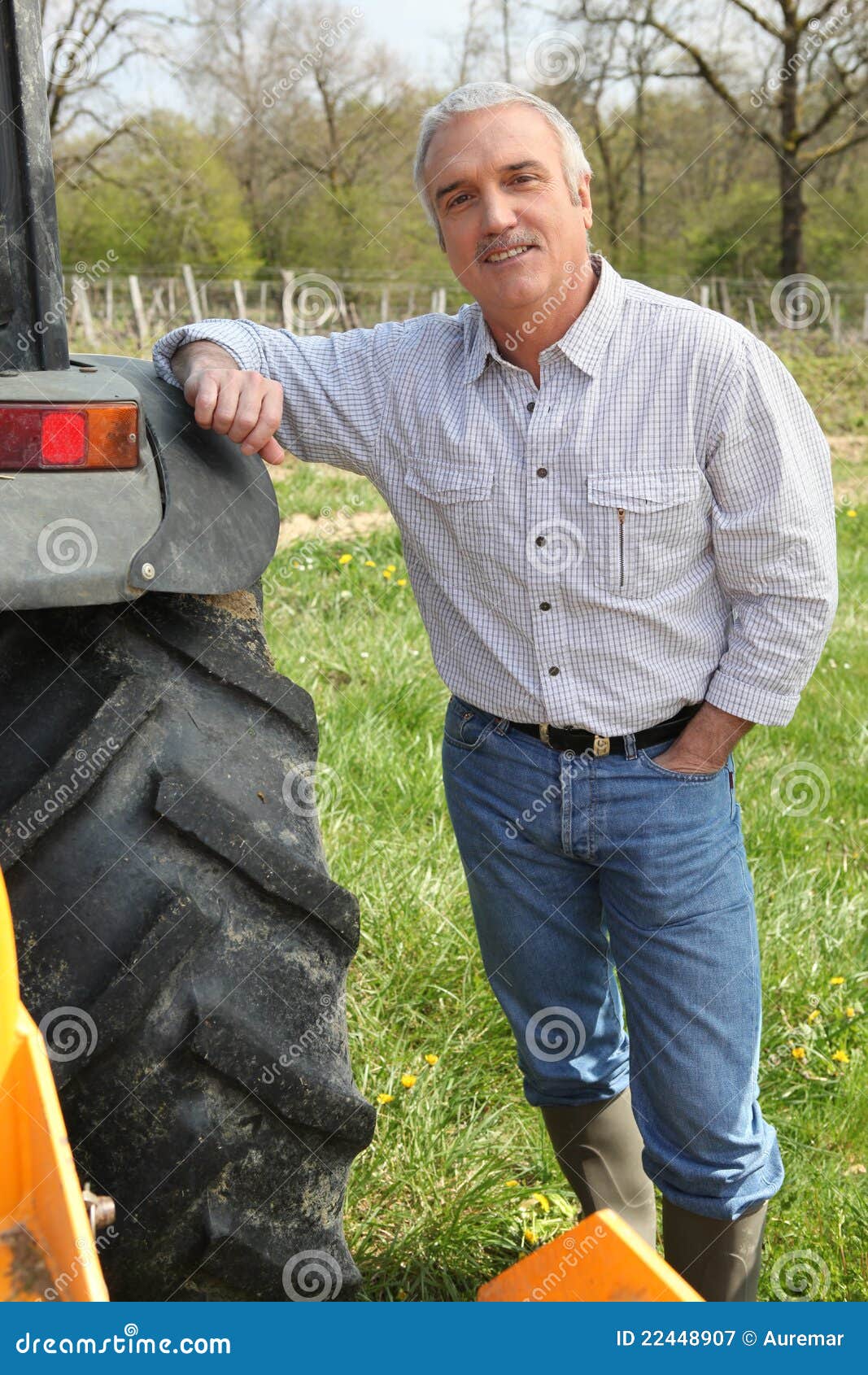 Man Standing Next To Tractor Stock Image - Image of farmer, laborer ...