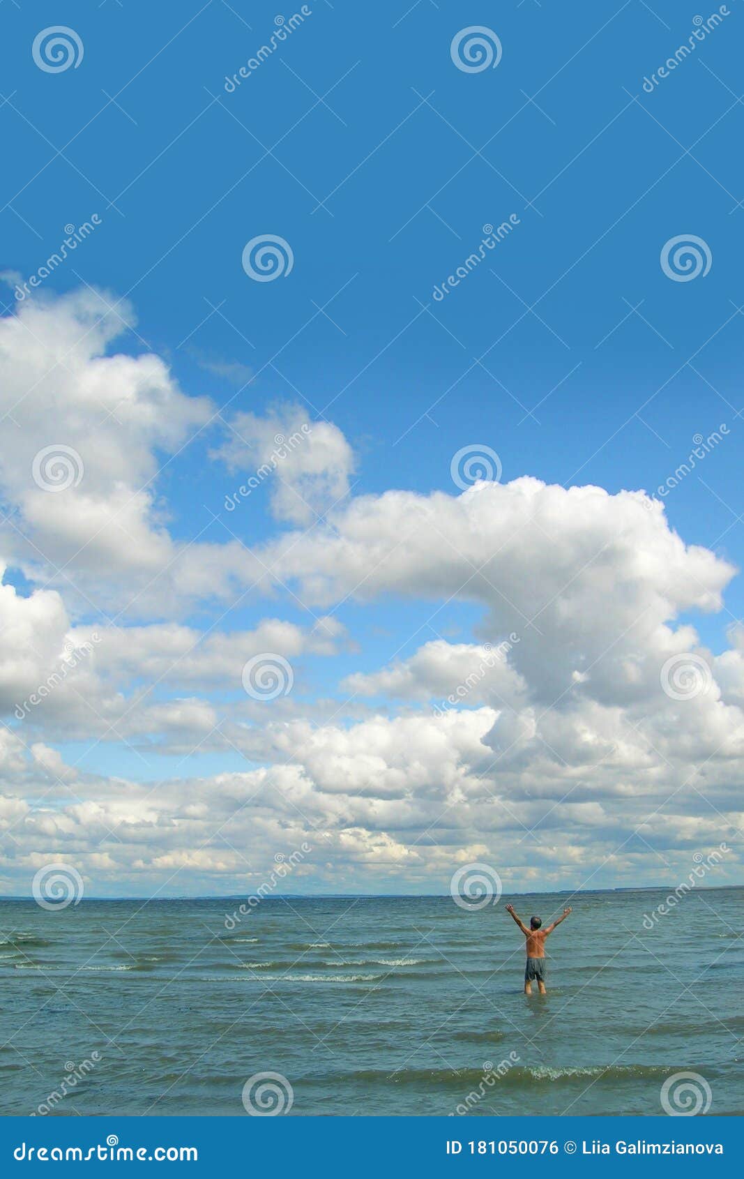 Man standing in the ocean editorial photo. Image of wave - 181050076