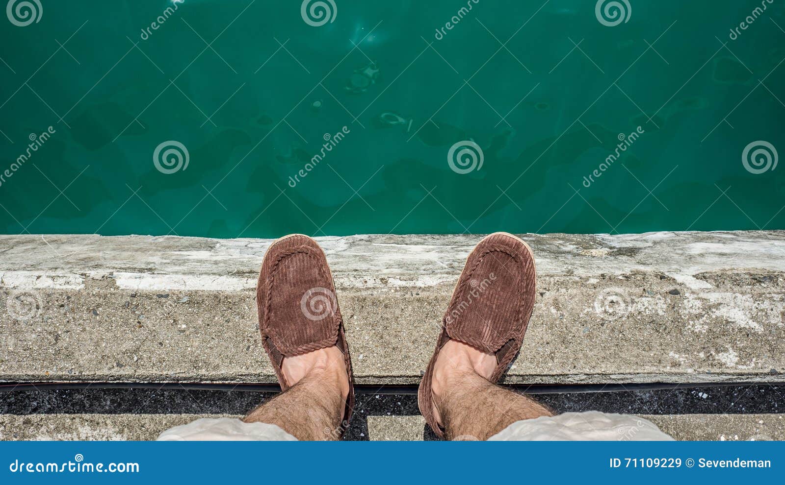 Man standing over the sea. stock image. Image of ledge - 71109229
