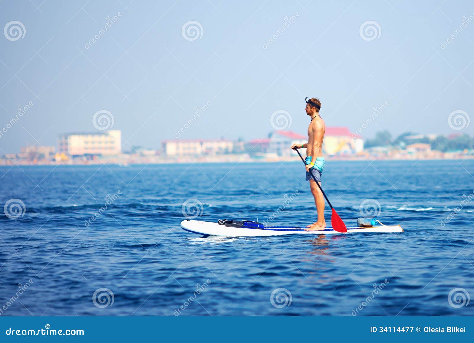 Man Standing on Paddle Board in the Sea Stock Image - Image of natural ...