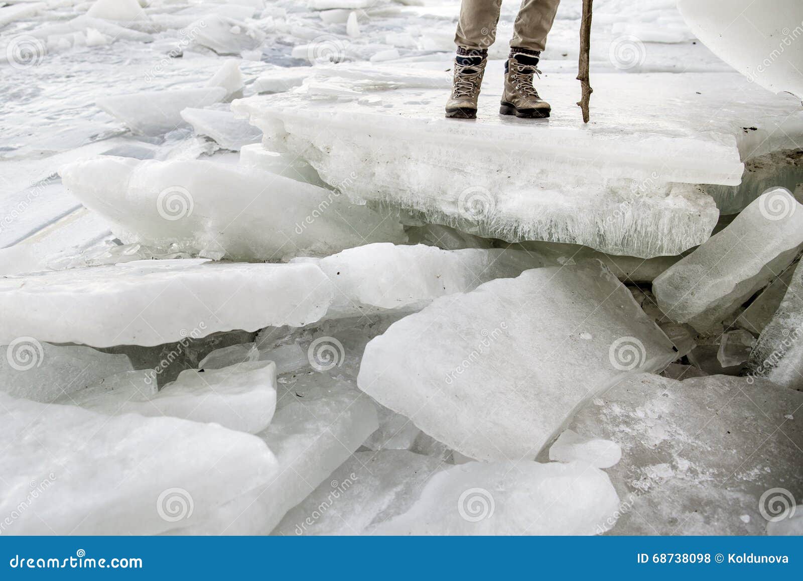 Man Standing on Pile of Ice Stock Photo - Image of water, weather: 68738098