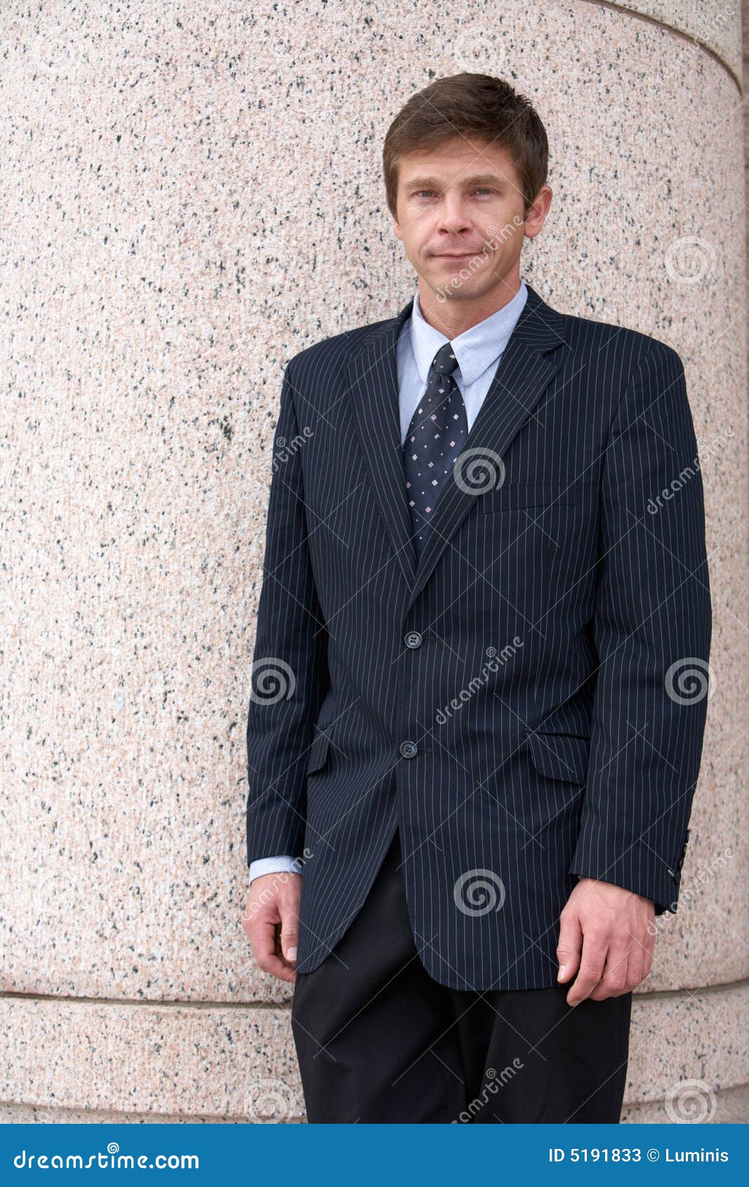 Man standing by pillar stock image. Image of businessman - 5191833