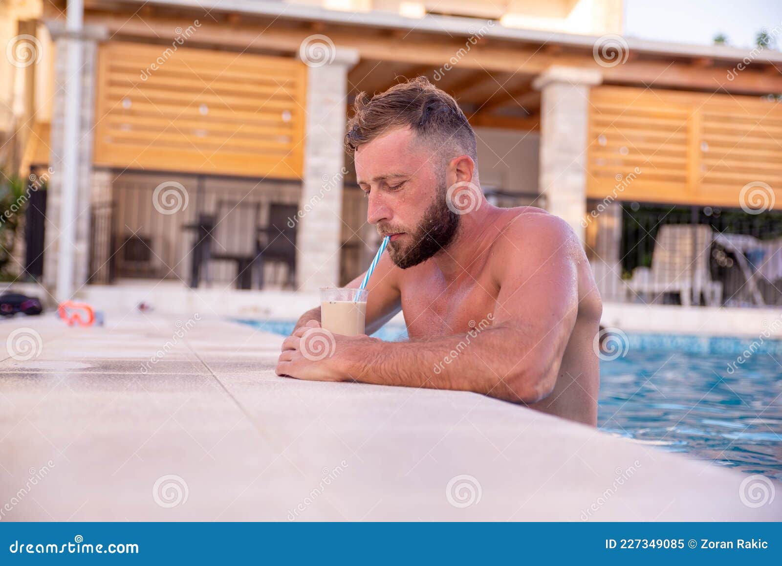 A Man Standing in the Pool Drinking Coffee Stock Image - Image of skin ...