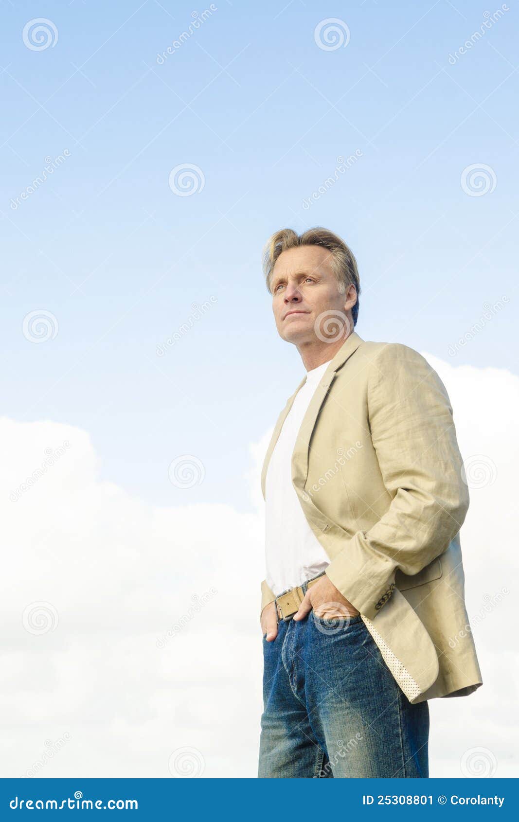 Man Standing in Profile Wearing a Beige Colored Ja Stock Image - Image ...