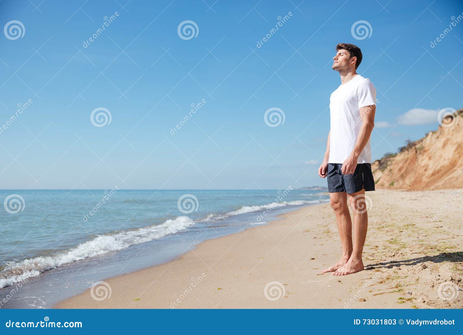 Man Standing and Relaxing on the Beach Stock Image - Image of happy ...