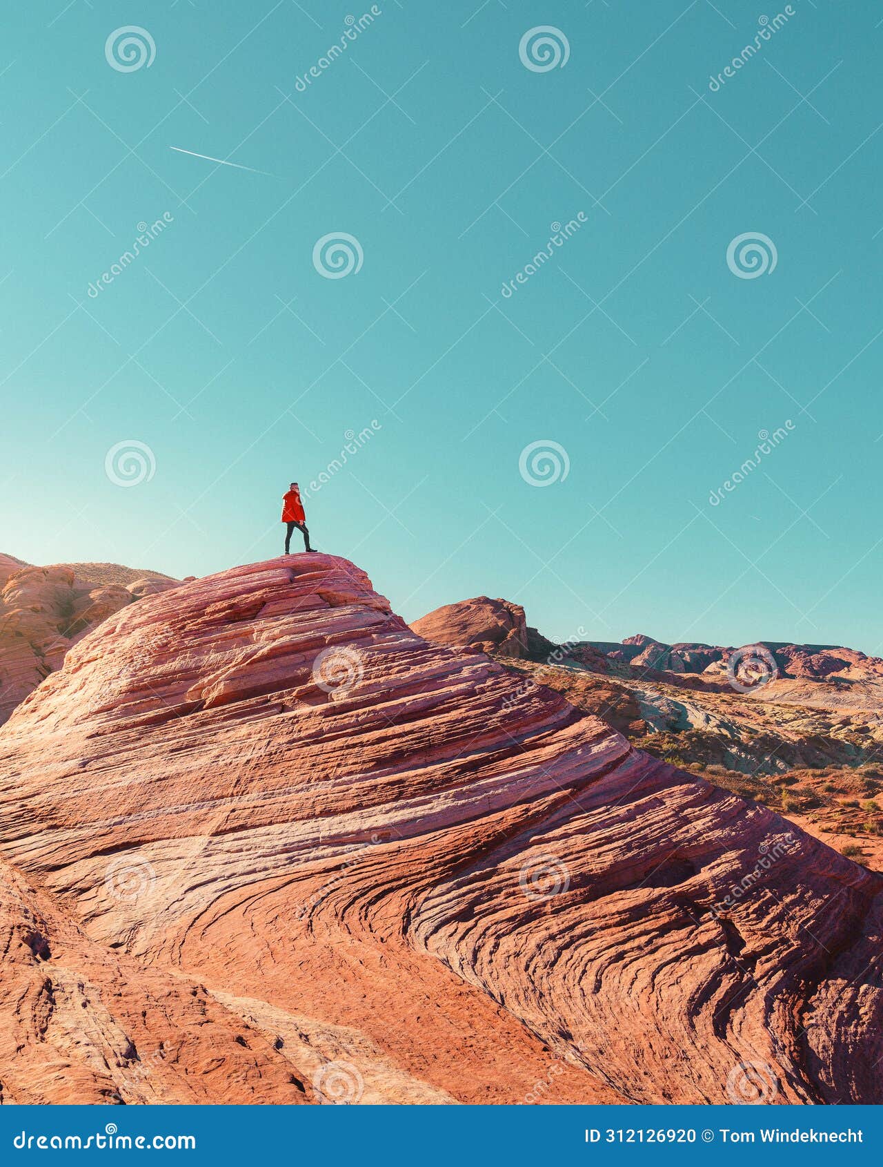 Man Standing on Rock at the Fire Wave in Valley of Fire State Park ...