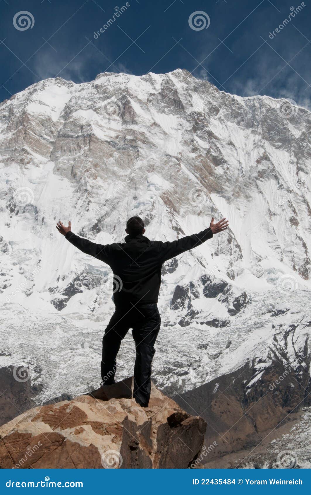 Man Standing on Rock in Front of Mountain Stock Photo - Image of ...