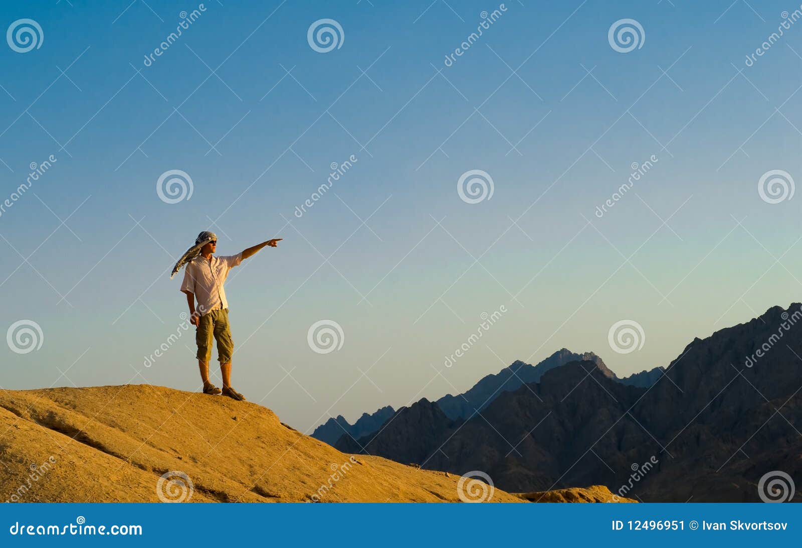 Man Standing on Rock Summit in Desert Stock Image - Image of mountain ...