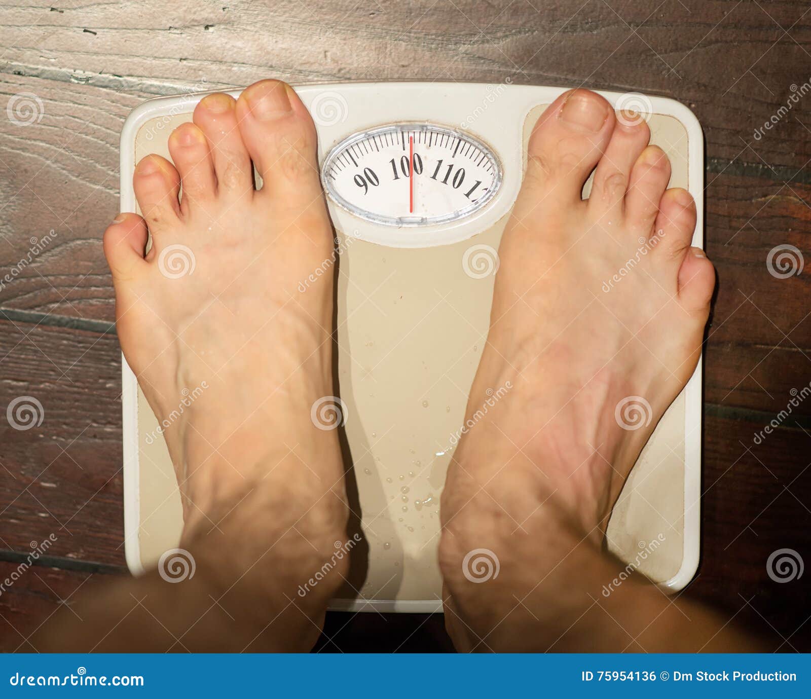 Man standing on scales. stock photo. Image of legs, bathroom - 75954136