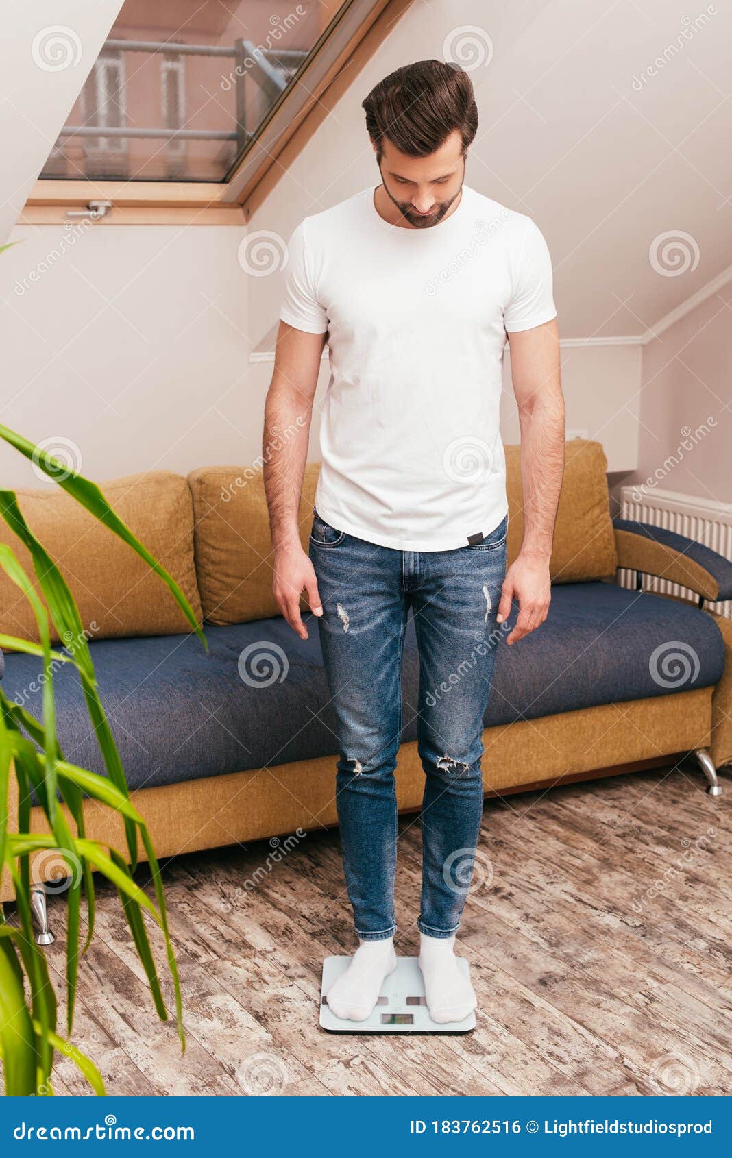 Handsome Man Standing on Scales in Stock Photo - Image of measurement ...