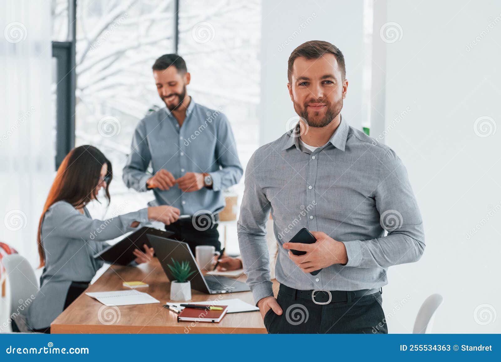 Man Standing and Smiling. Group of Business People that Working on the ...