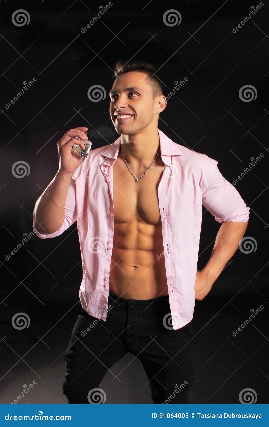 Man Standing and Spraying Perfume Over Himself. Stock Image - Image of ...