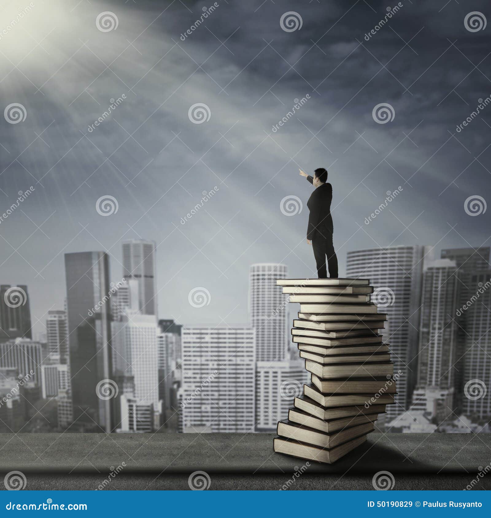 Man Standing on a Stack of Books Stock Image - Image of business, male ...