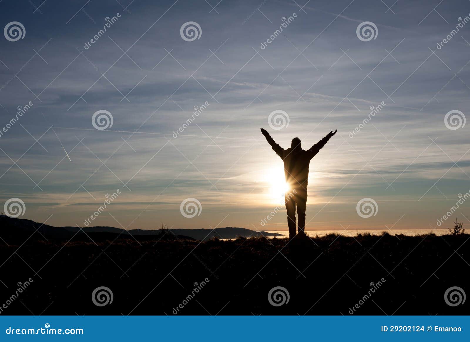 Man Standing in Sunset on Mountain Stock Photo - Image of dawn, ocean ...