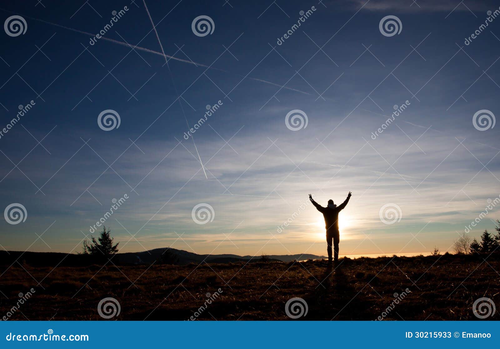 Man Standing in Sunset on Mountain Stock Image - Image of mountain ...