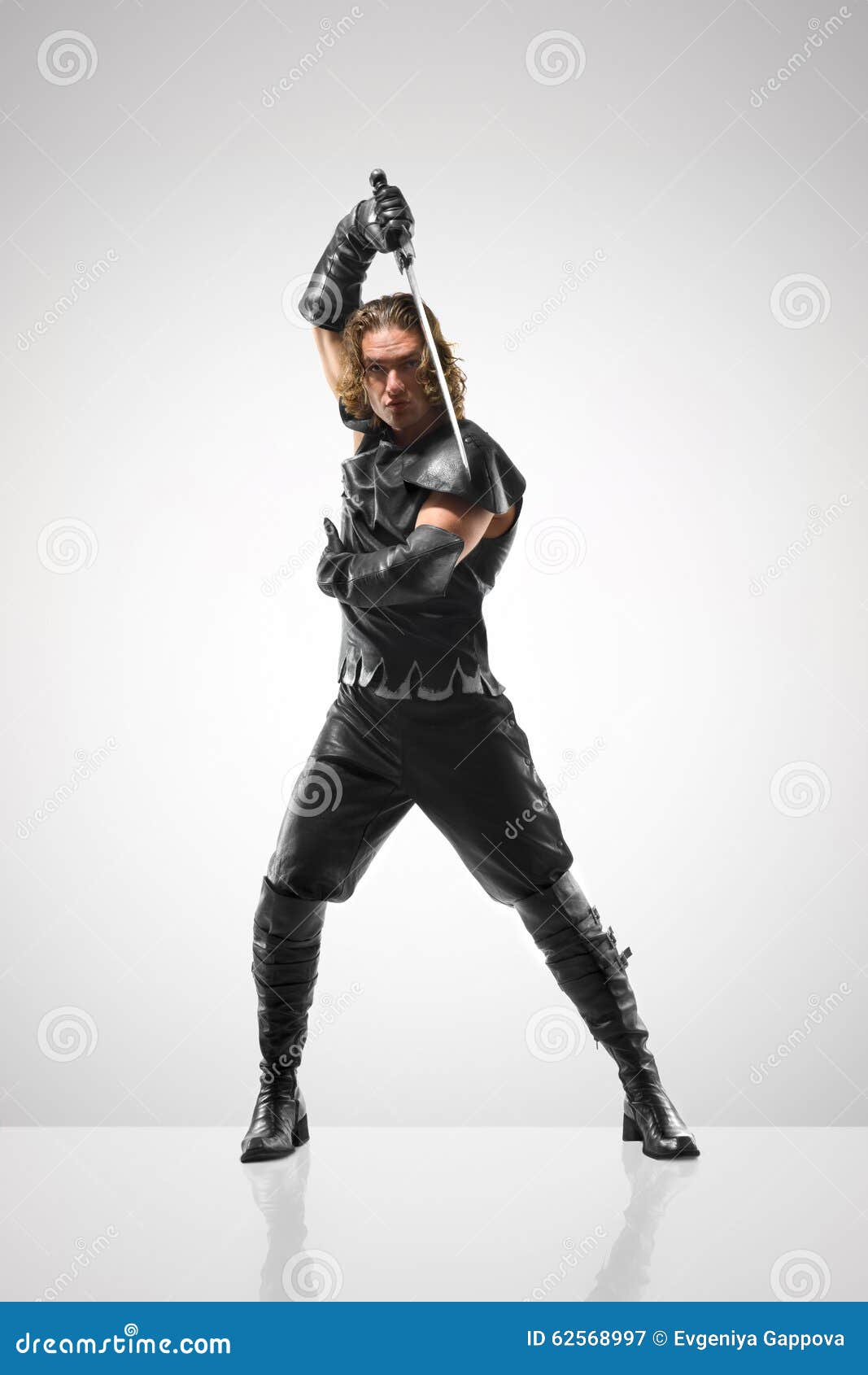 Man standing with a sword stock image. Image of adult - 62568997