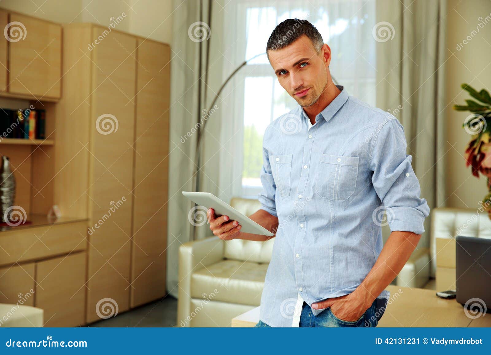 Man Standing with Tablet Computer at Home Stock Image - Image of ...