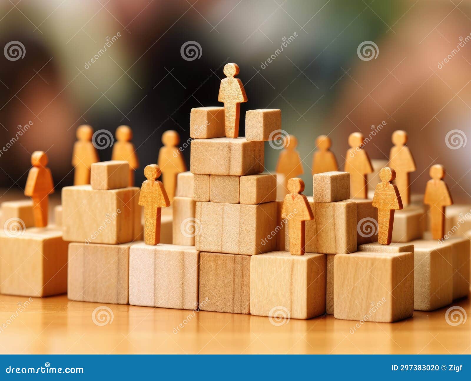 Man Standing on Top of a Stack of Wooden Cubes with Other People Behind ...