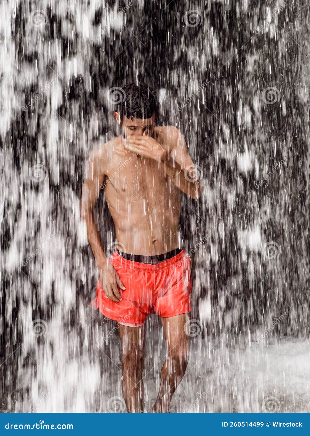 Man Standing Under a Waterfall Stock Image - Image of adventure, drops ...