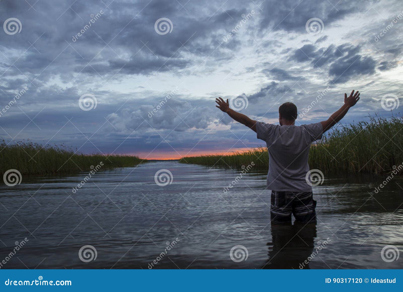 Man standing in a water stock photo. Image of relaxation - 90317120