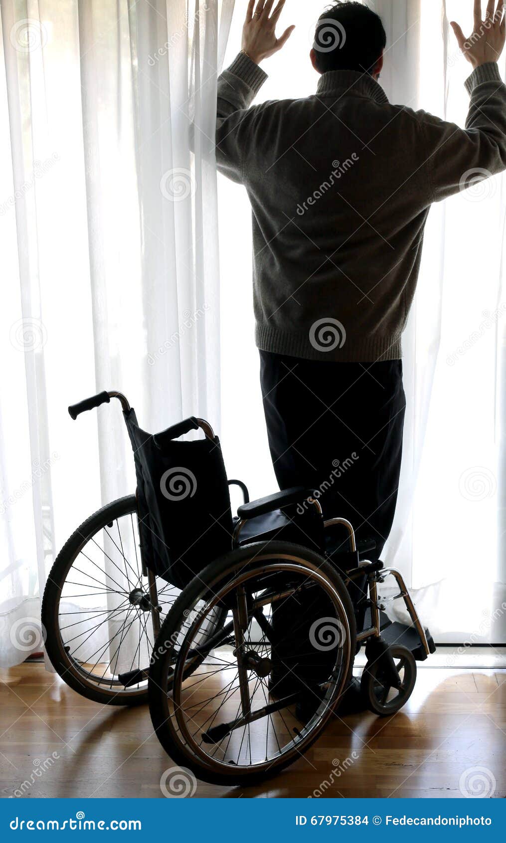 Man Standing with the Wheelchair by the Window Stock Photo - Image of ...