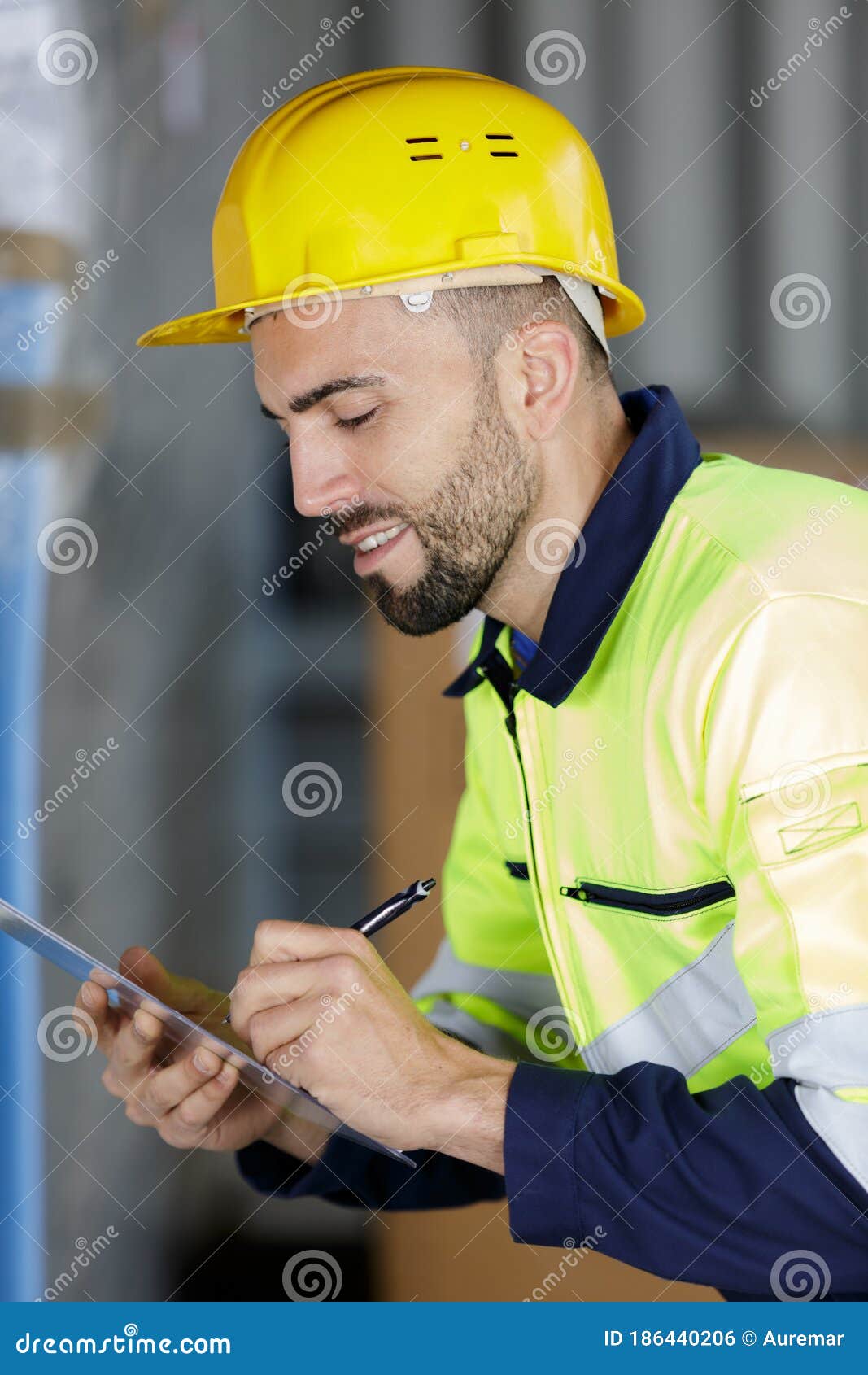 Man Standing and Writing in Folder Stock Photo - Image of document ... Man Standing and Writing in Folder Stock Photo - Image of document ...