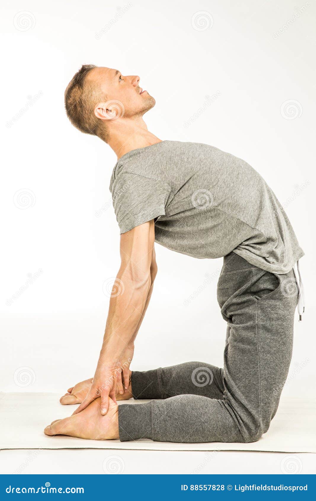 Man standing in yoga pose stock photo. Image of sportsman - 88557828