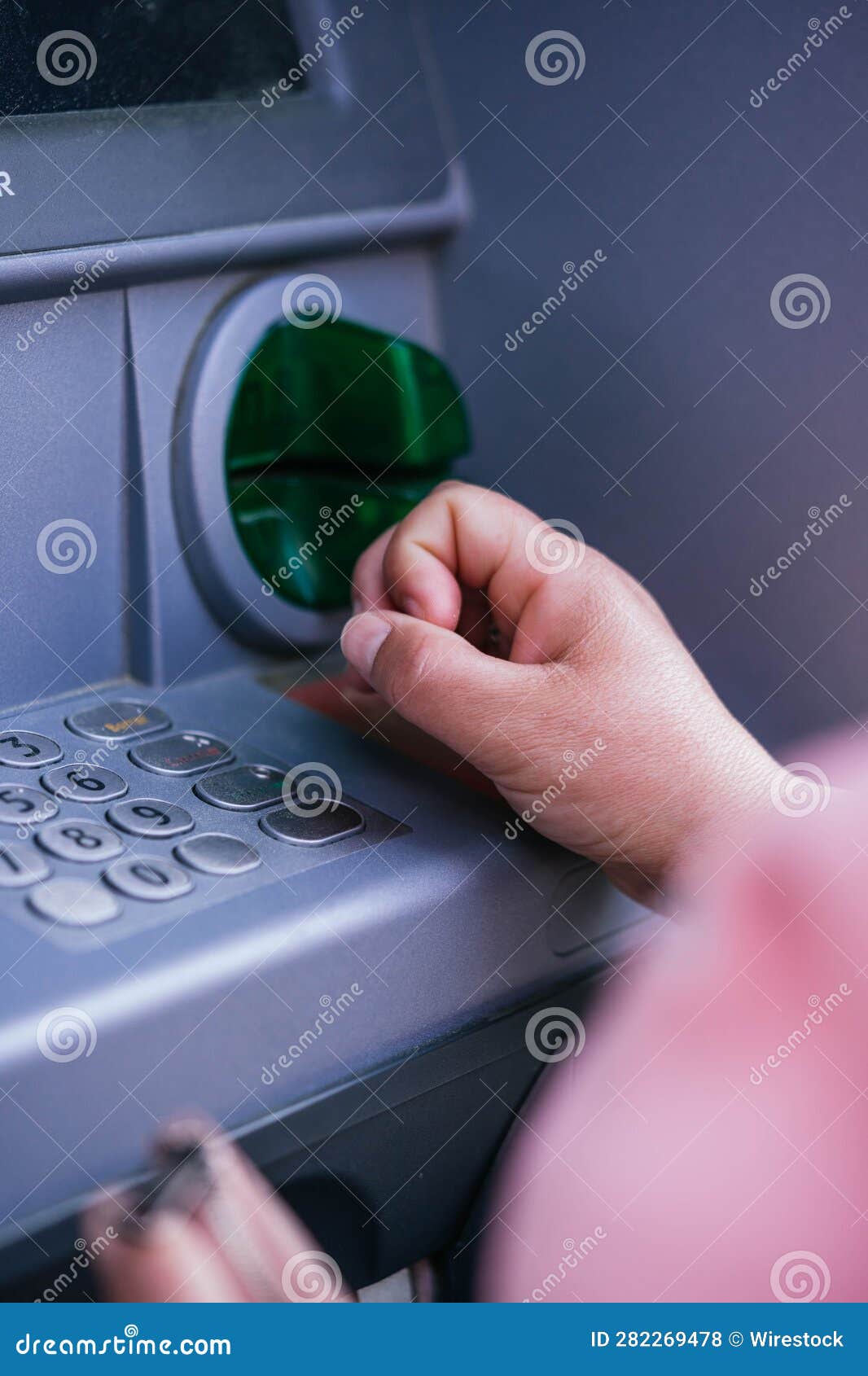 Someone Using an Atm Machine with the Keys Pointed Out in the Front ...