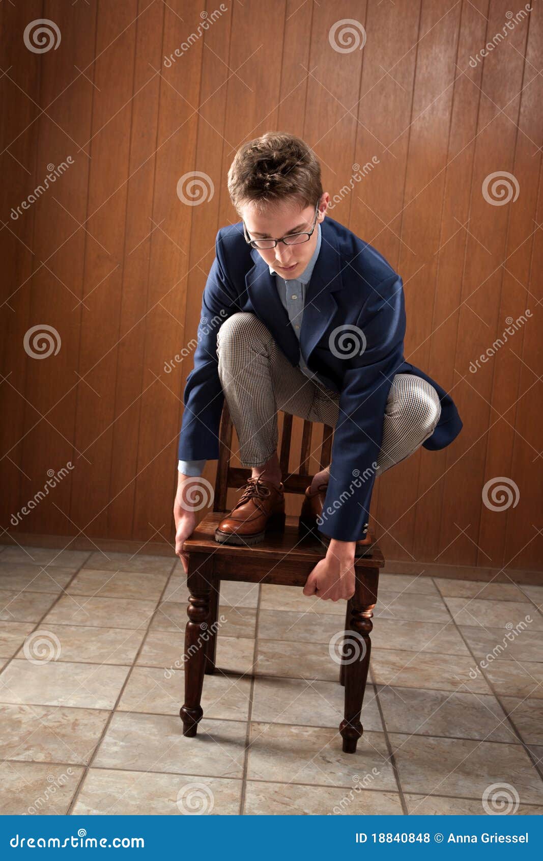 Man Stands on Chair stock photo. Image of businessman - 18840848
