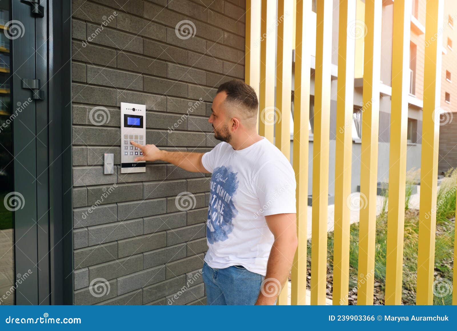 Man Stands at the Residential Building and Dials the Code from the ...