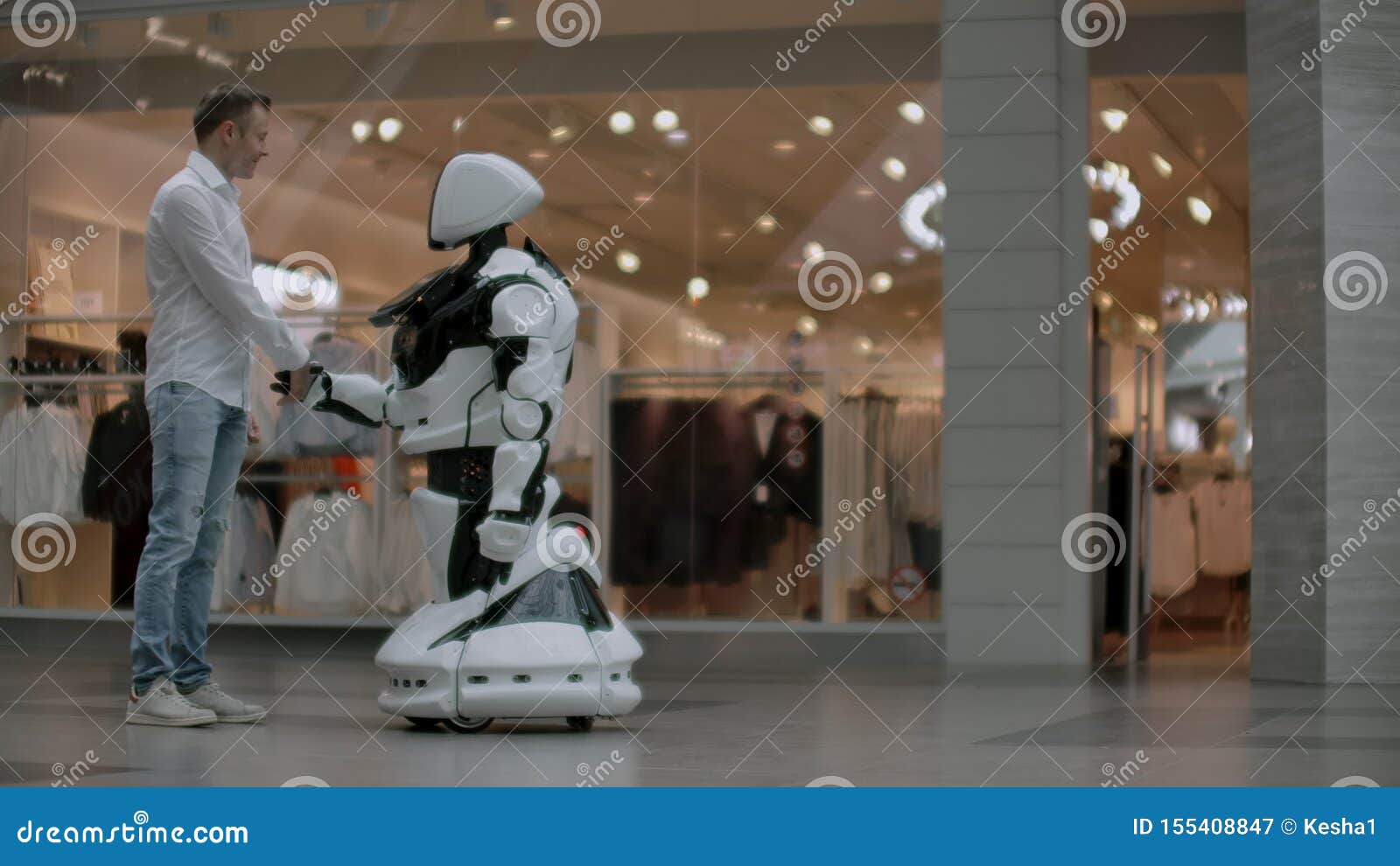 A Man Stands with a Robot Bot and Asks Him Questions and Asks for Help ...