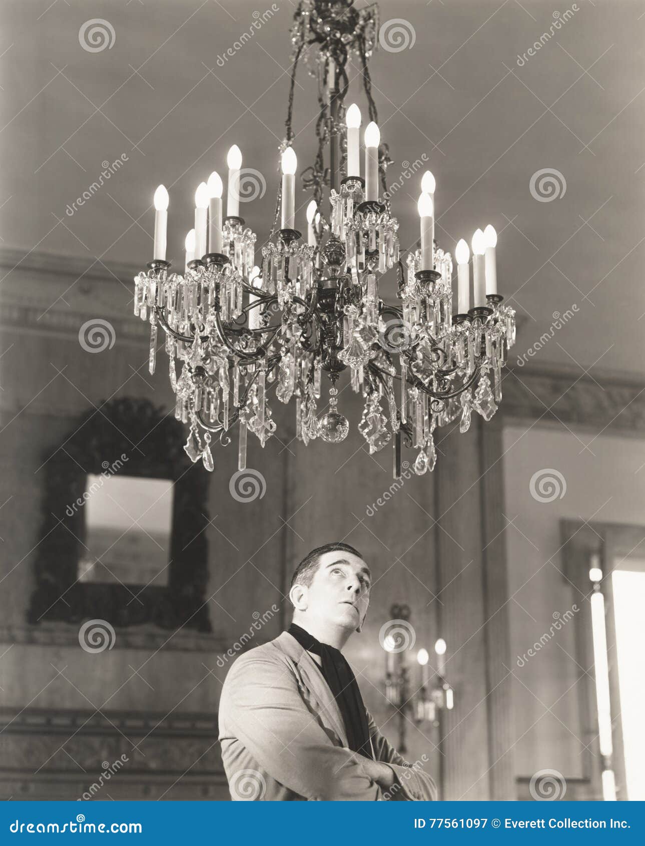 Man staring at chandelier stock image. Image of fashioned - 77561097