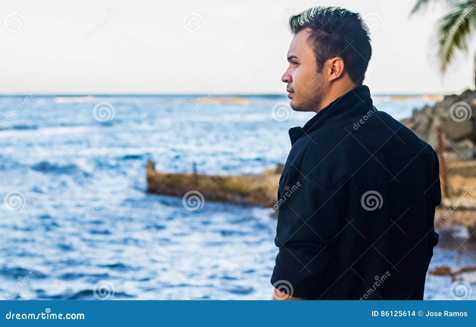 Man staring at the sea stock photo. Image of apparel - 86125614