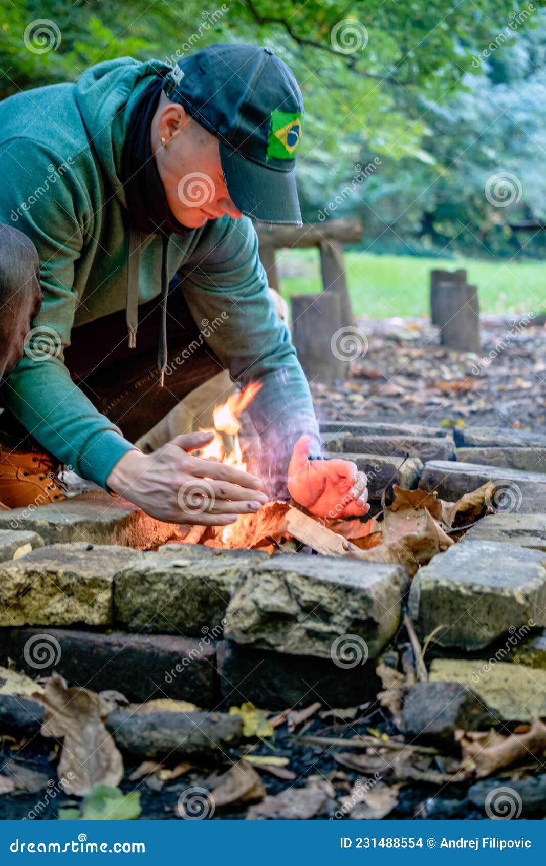 Man Starting a Fire for the Barbeque in the Woods. Stock Photo - Image ...