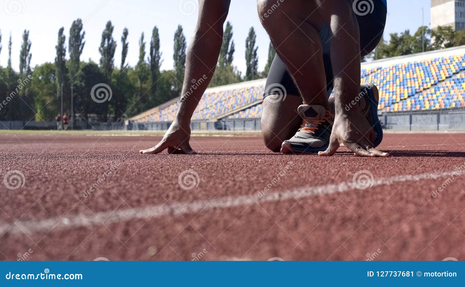Man in Starting Position on Track, Professional Runner Training at ...