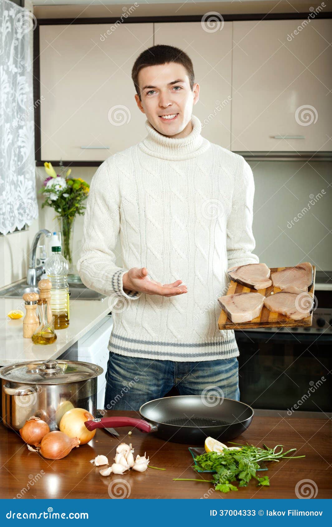 Man with steak at home stock image. Image of cooking - 37004333