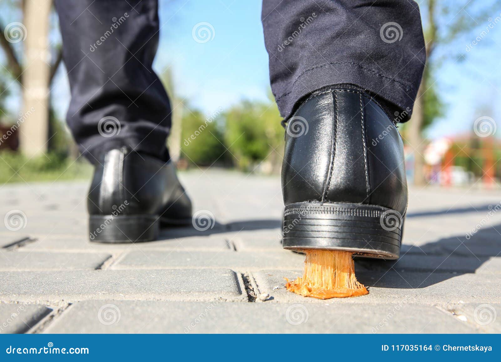 Man Stepping in Chewing Gum on Sidewalk Stock Photo - Image of road ...