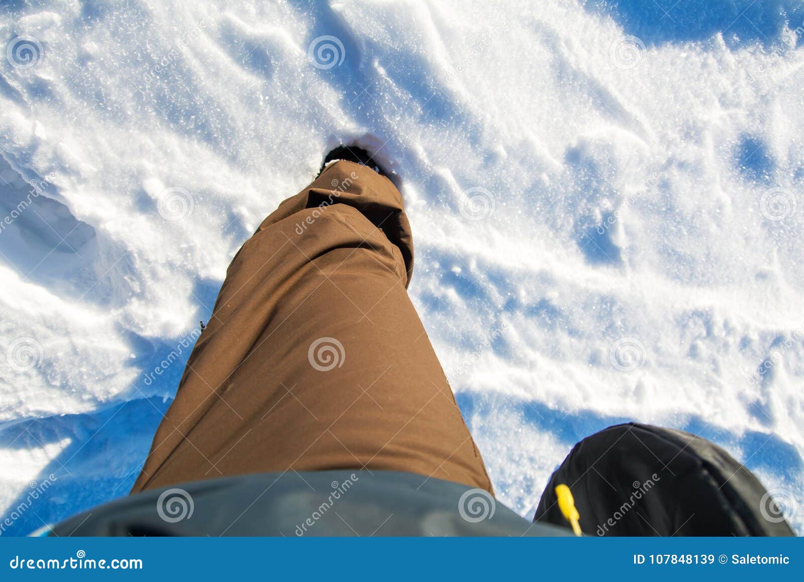 Man leg into deep snow stock image. Image of pants, cold - 107848139